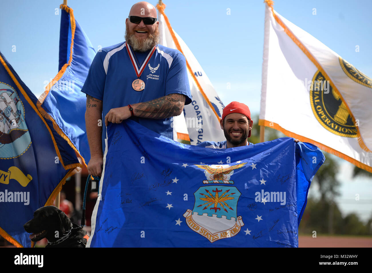 Air Force athletes Keith Sekora(left) and Ryan Pinney receive the gold ...