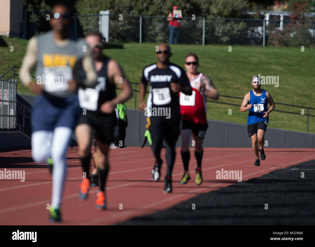 Air Force athlete Daniel Neild (right) makes his way towards the finish ...
