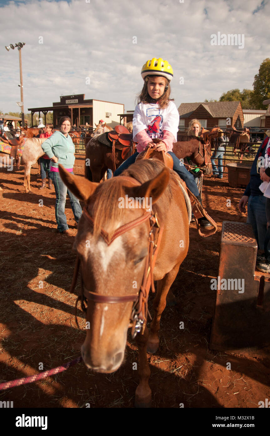 A girl rides a horse during the 3rd annual Horseback Heroes event at ...