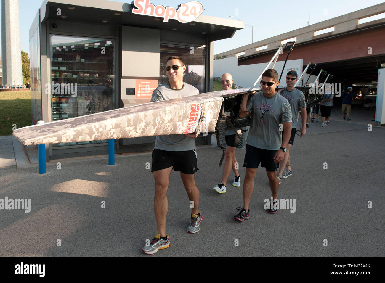 Eight members of the Oklahoma Army National Guard Rowing Team carry ...