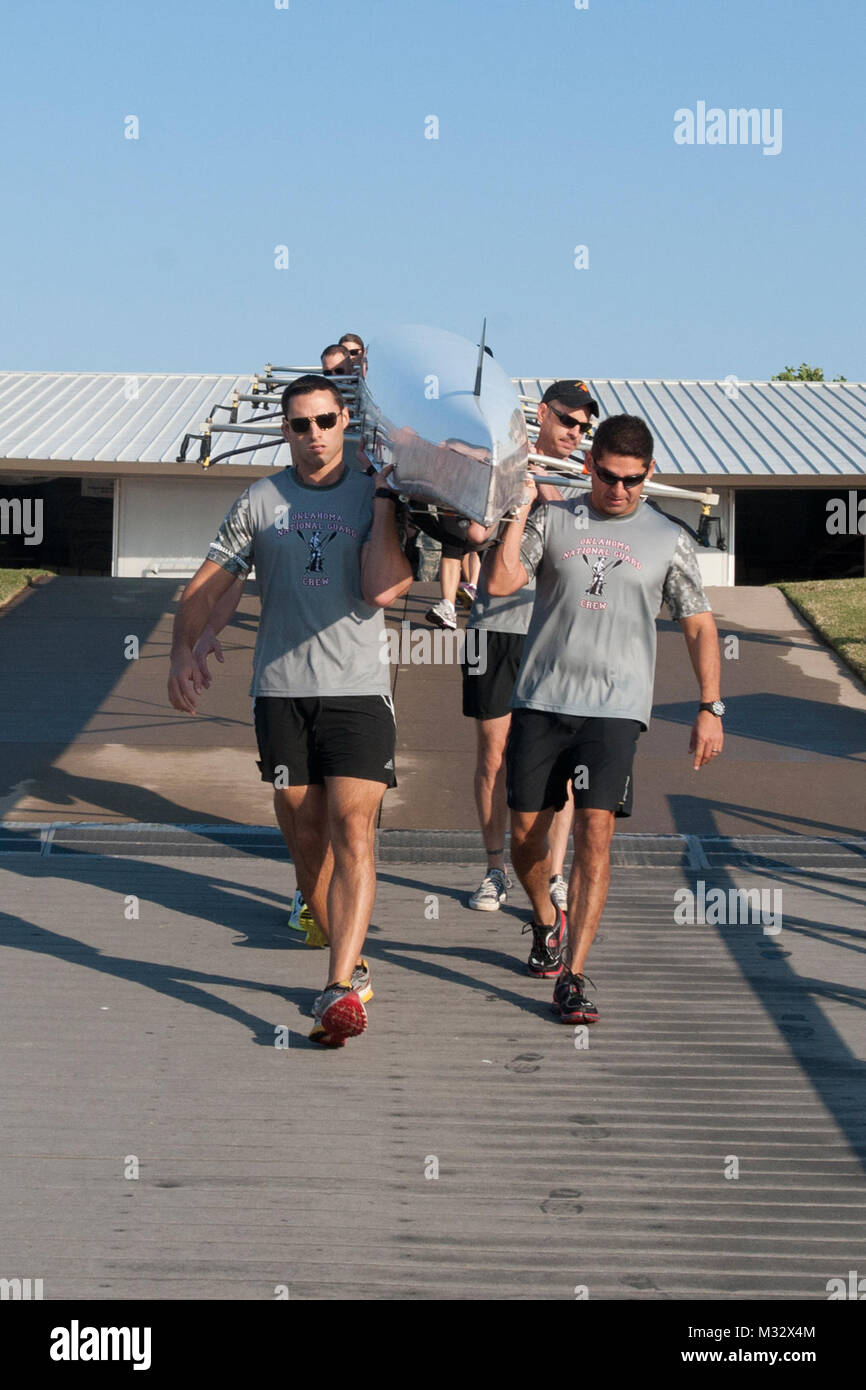 Eight members of the Oklahoma Army National Guard Rowing Team carry ...