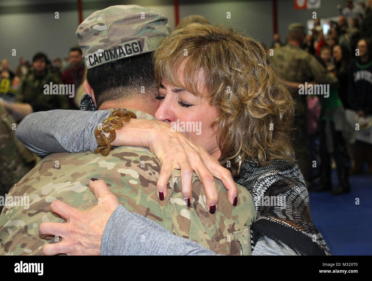 Aleida Capomaggi embraces her son, 1st Lt. Michael Capomaggi Jan. 16 ...