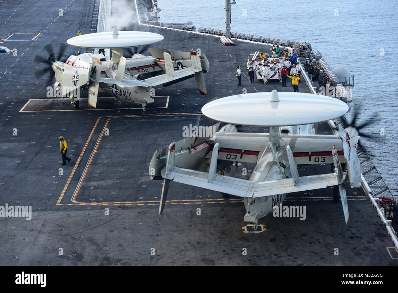 E-2C Hawkeyes prepare to launch from the aircraft carrier USS Carl ...