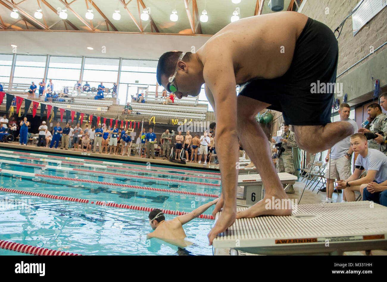 Scott Palomino prepares to dive in the swimming competition of the 2014 ...