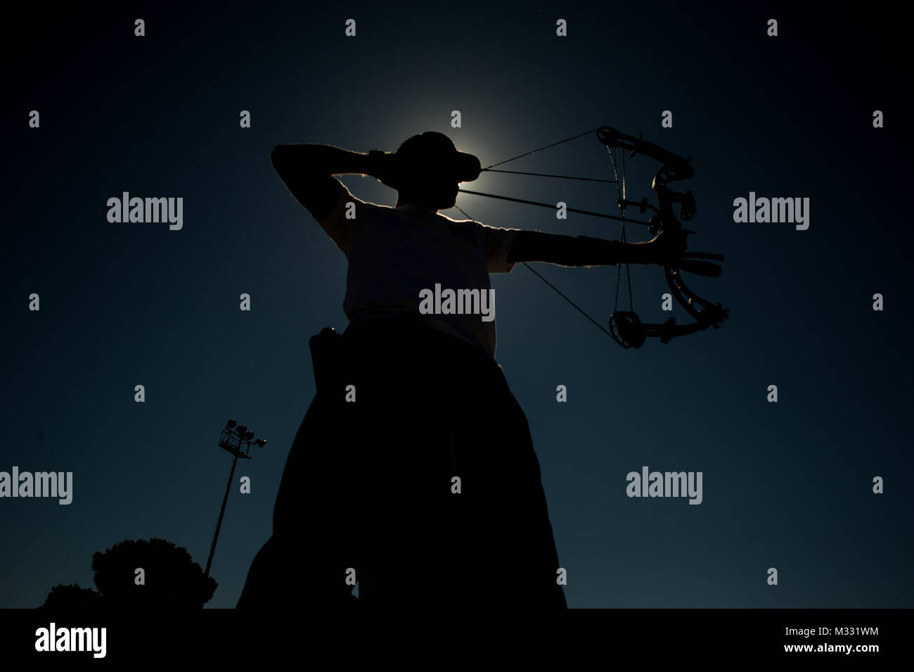 Justin McCrary, Air Force Wounded Warrior athlete, fires a bow during ...