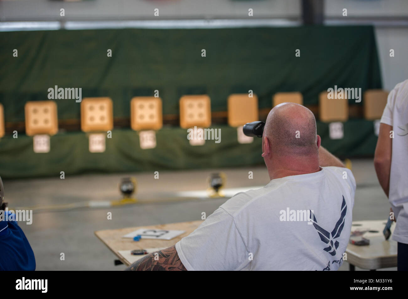 Keith Sekora, Air Force Wounded Warrior athlete, fires an air pistol ...