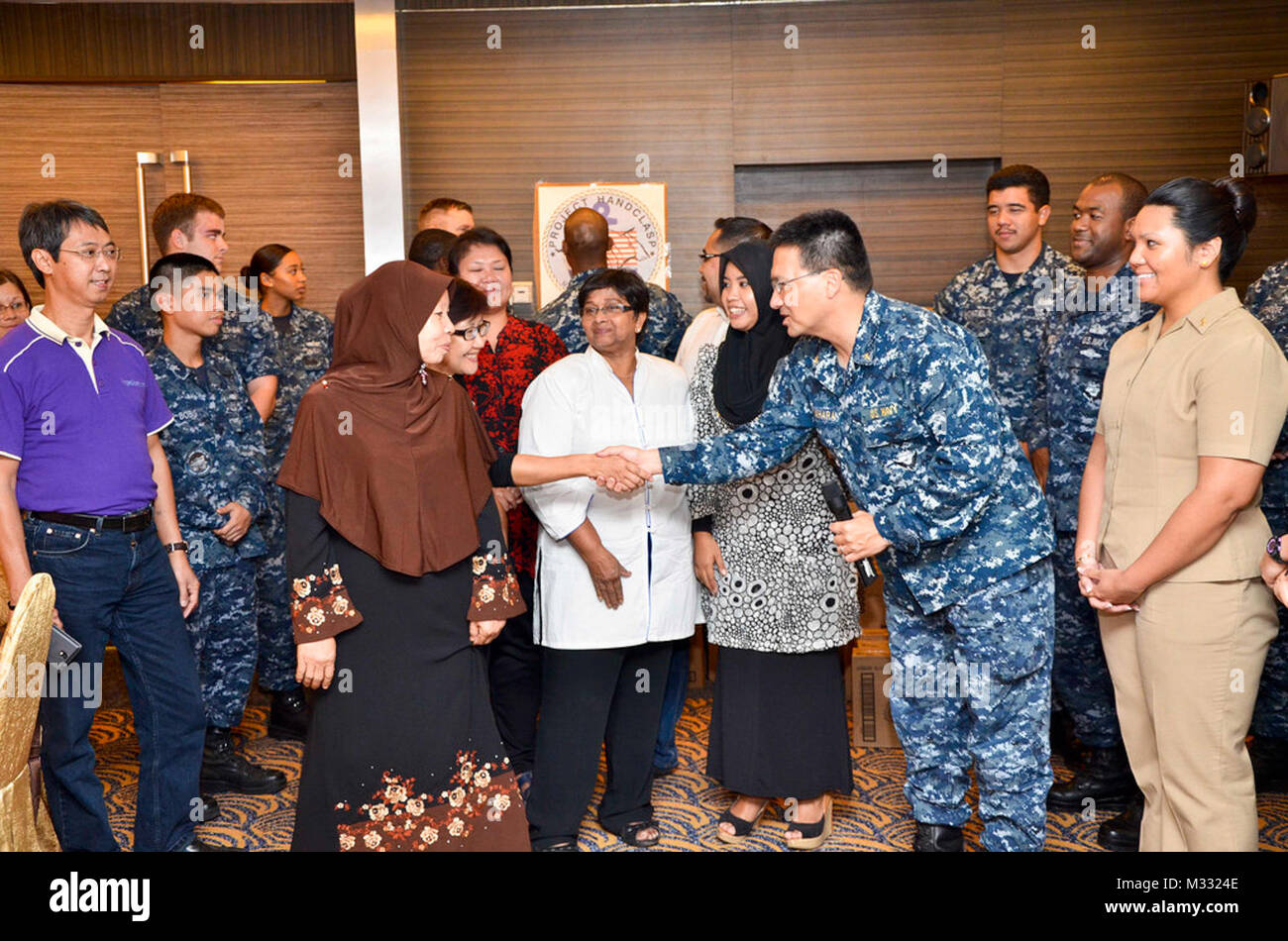 presented donations which included clothing and Project Handclasp to ...