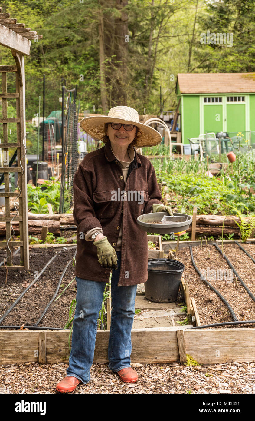 Woman vegetable patch spring happy hi-res stock photography and images ...