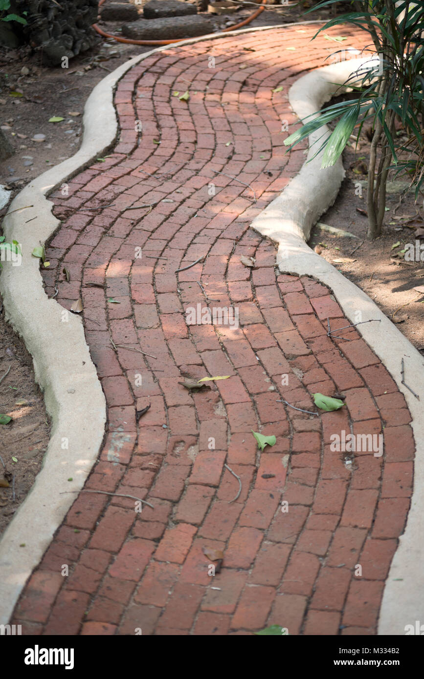 Pavement pathway in a garden Stock Photo - Alamy