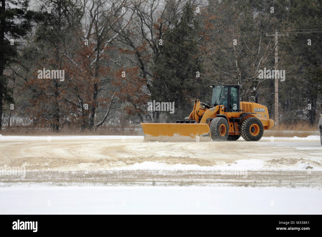 An equipment operator with the Fort McCoy snow removal contractor ...