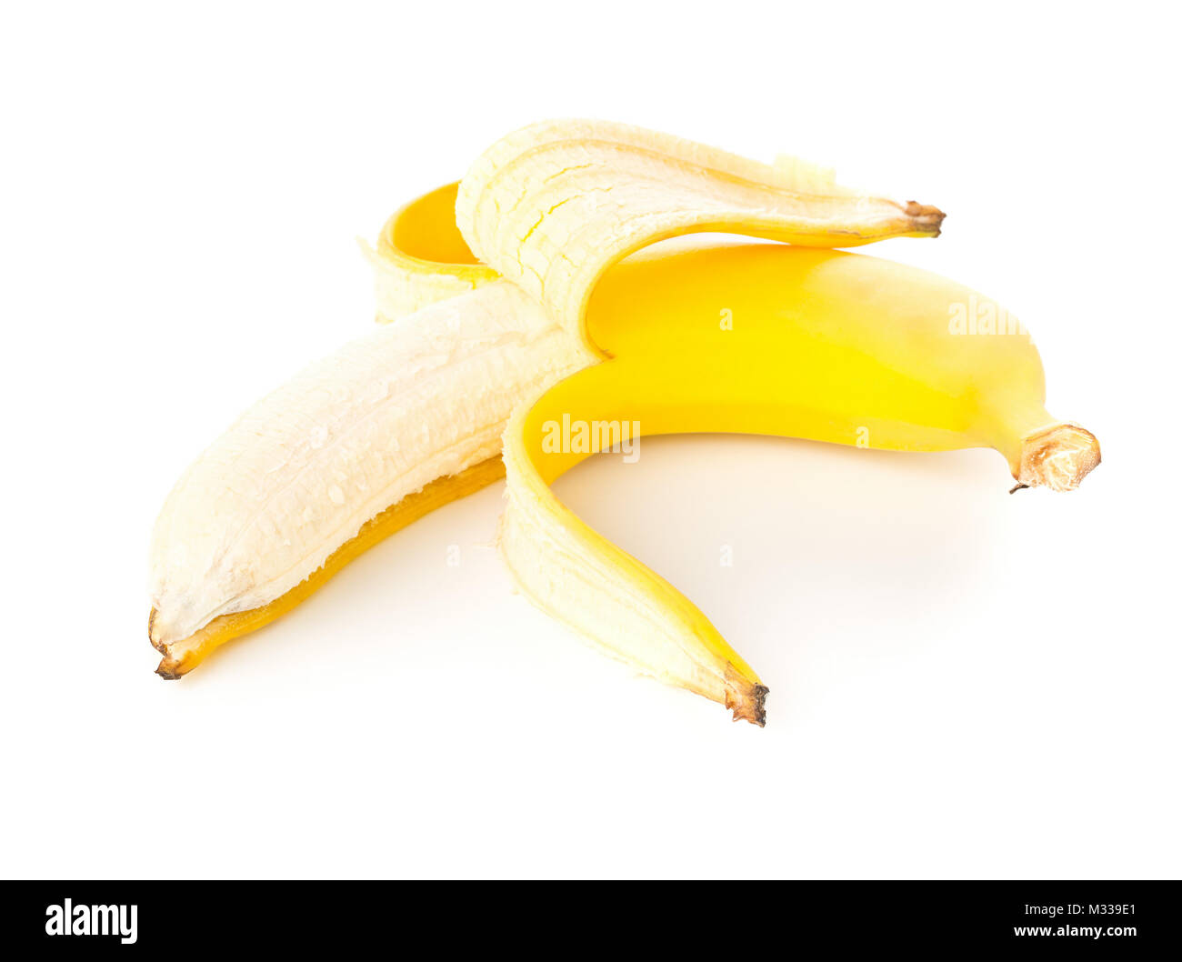 Single fresh, yellow, ripe banana half peeled over white background ...