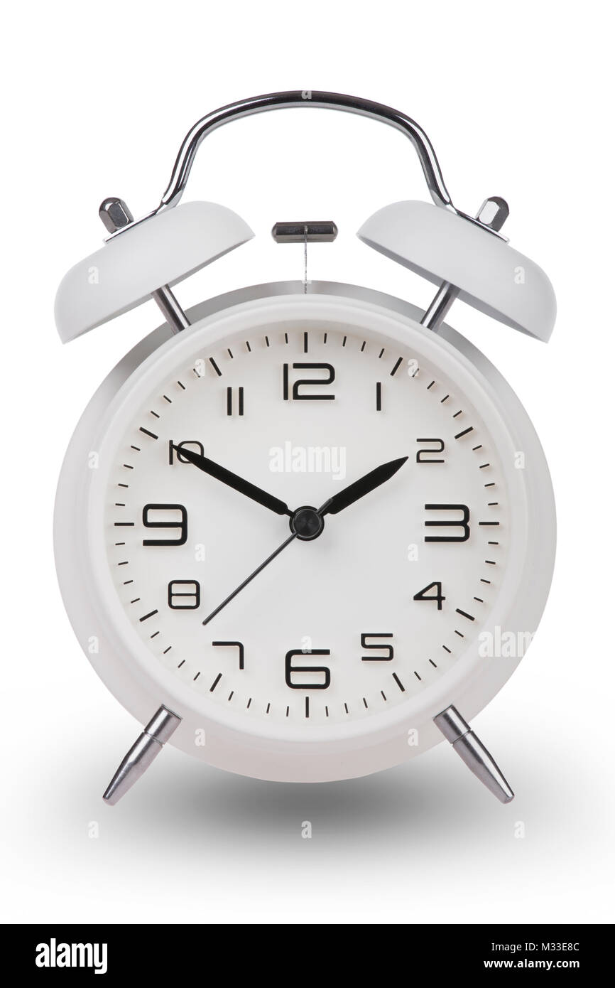 White alarm clock with the hands at 10 and 2 am or pm isolated on a ...