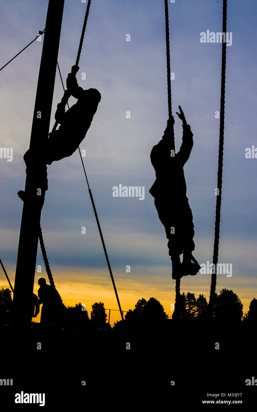 U.S. Marine Corps officer candidates participate in an obstacle course ...