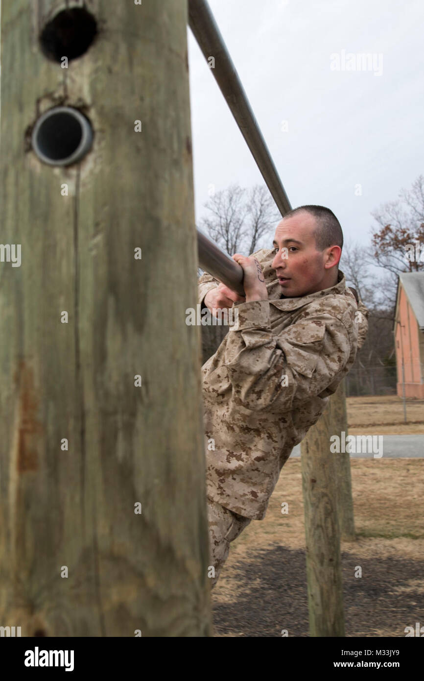 U.S. Marine Corps officer candidates participate in an obstacle course ...