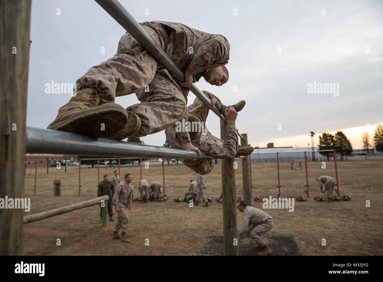 U.S. Marine Corps officer candidates participate in an obstacle course ...
