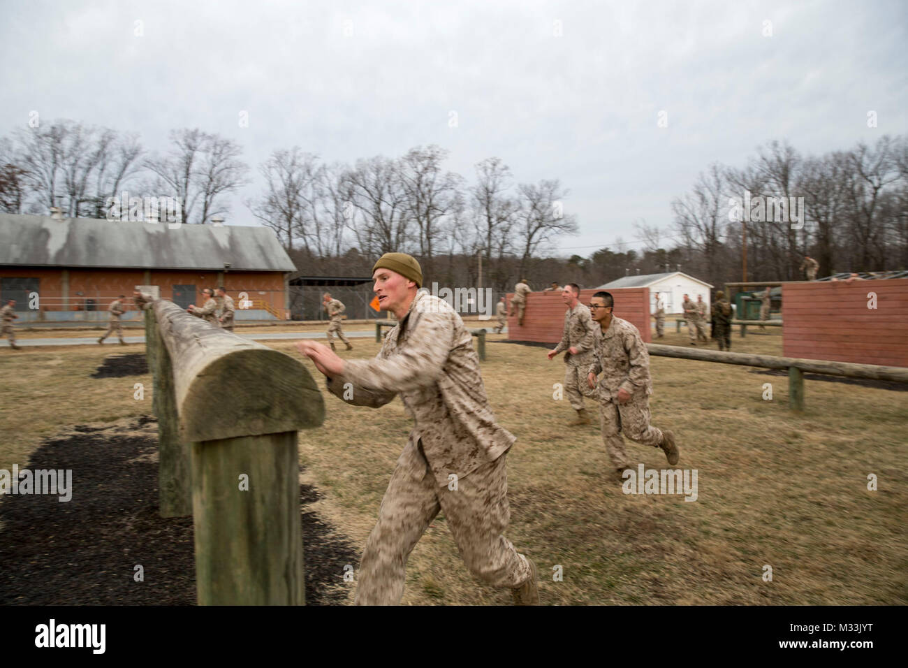 U.S. Marine Corps officer candidates participate in an obstacle course ...