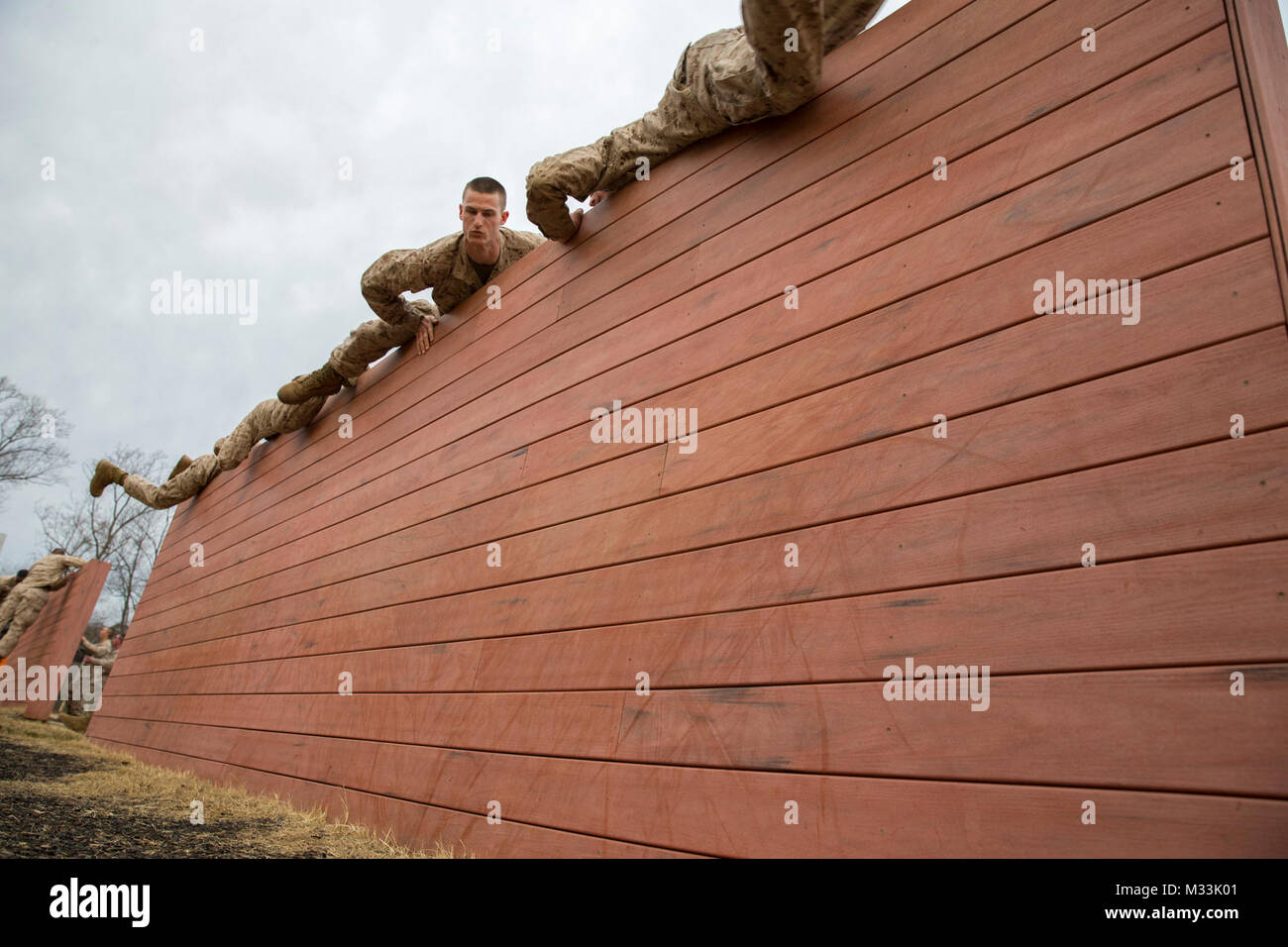 U.S. Marine Corps officer candidates participate in an obstacle course ...