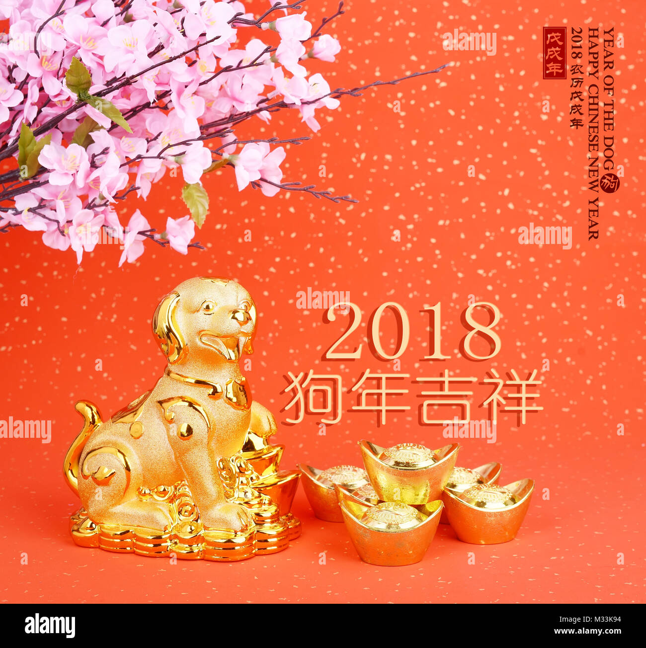 golden dog statue on red paper,translation of calligraphy: good Fortune ...