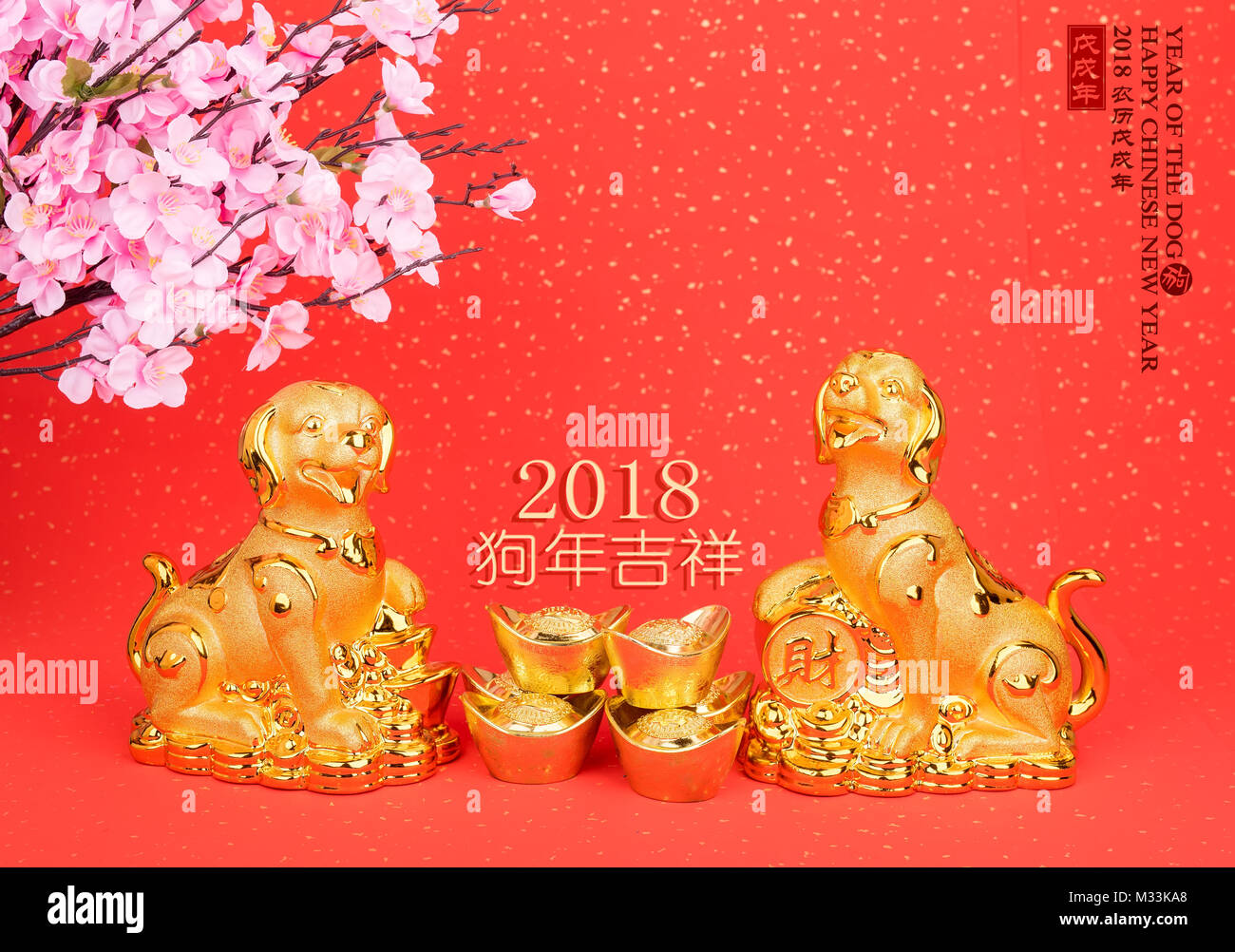 golden dog statue on red paper,translation of calligraphy: good Fortune ...