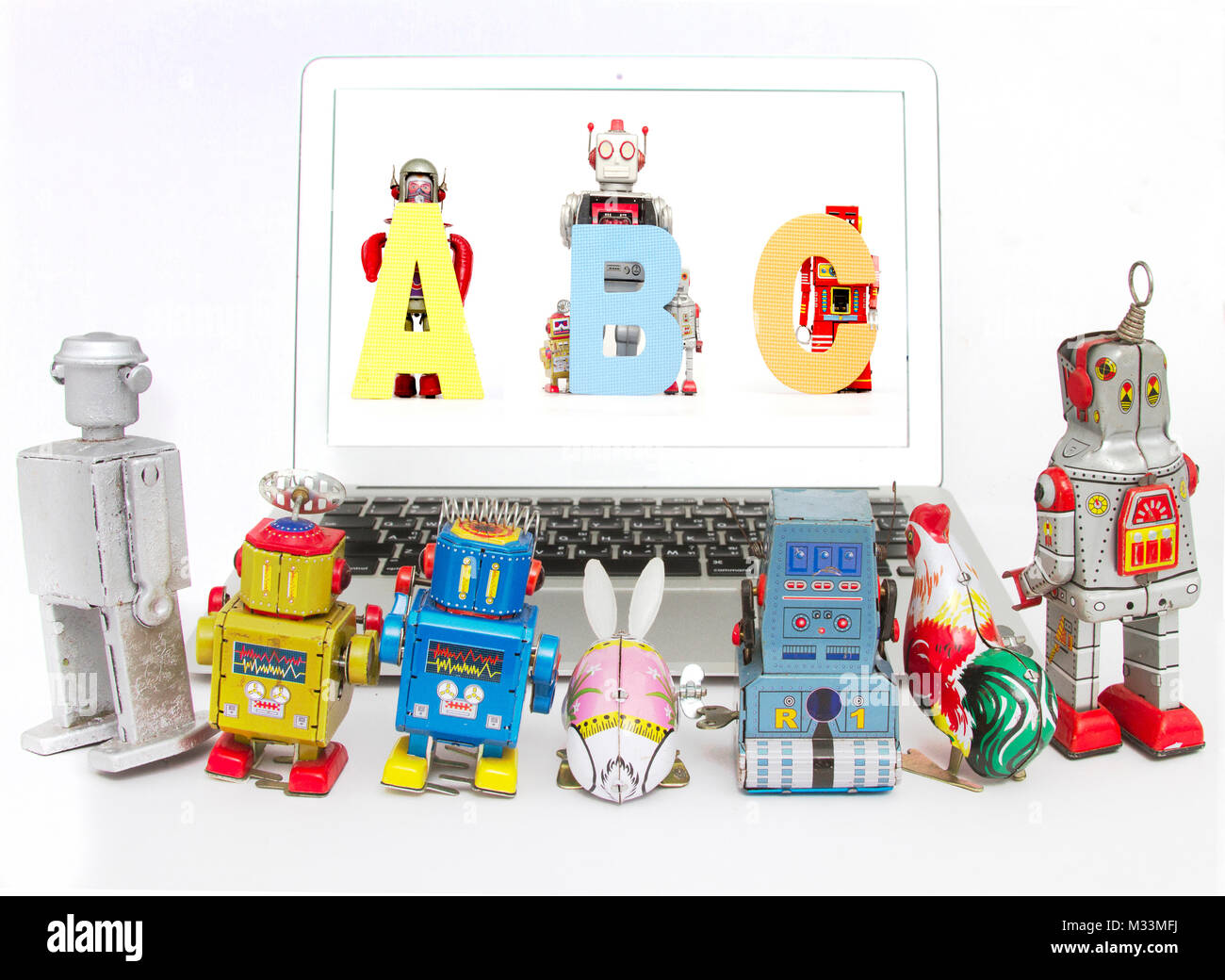 robots teching robots ABC on a laptop Stock Photo - Alamy