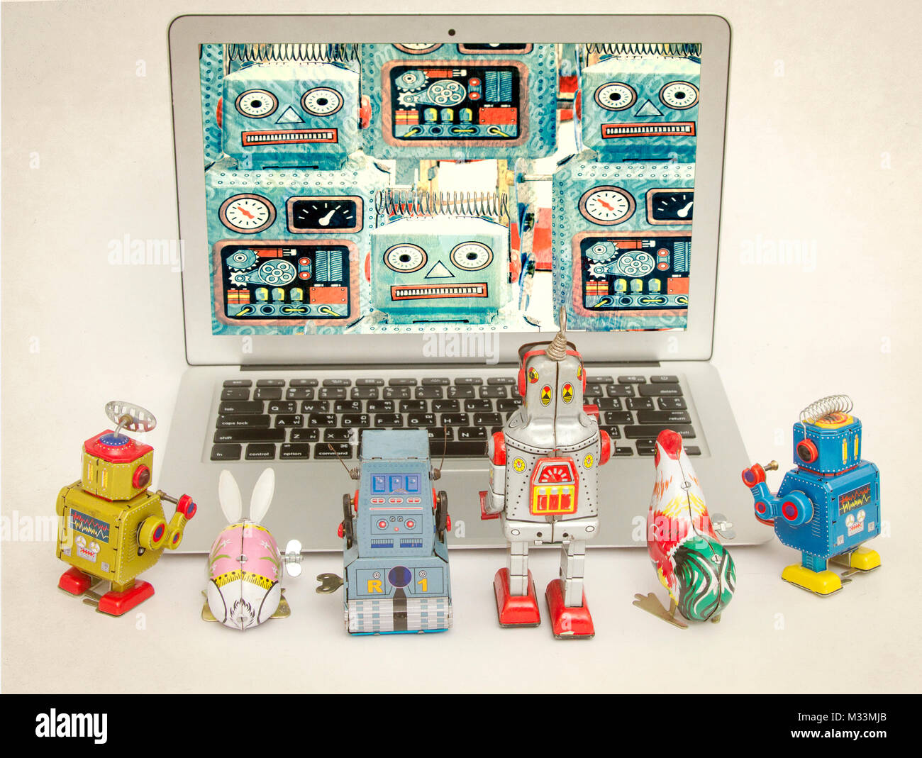 Machine learning concept with retro toy robots Stock Photo - Alamy