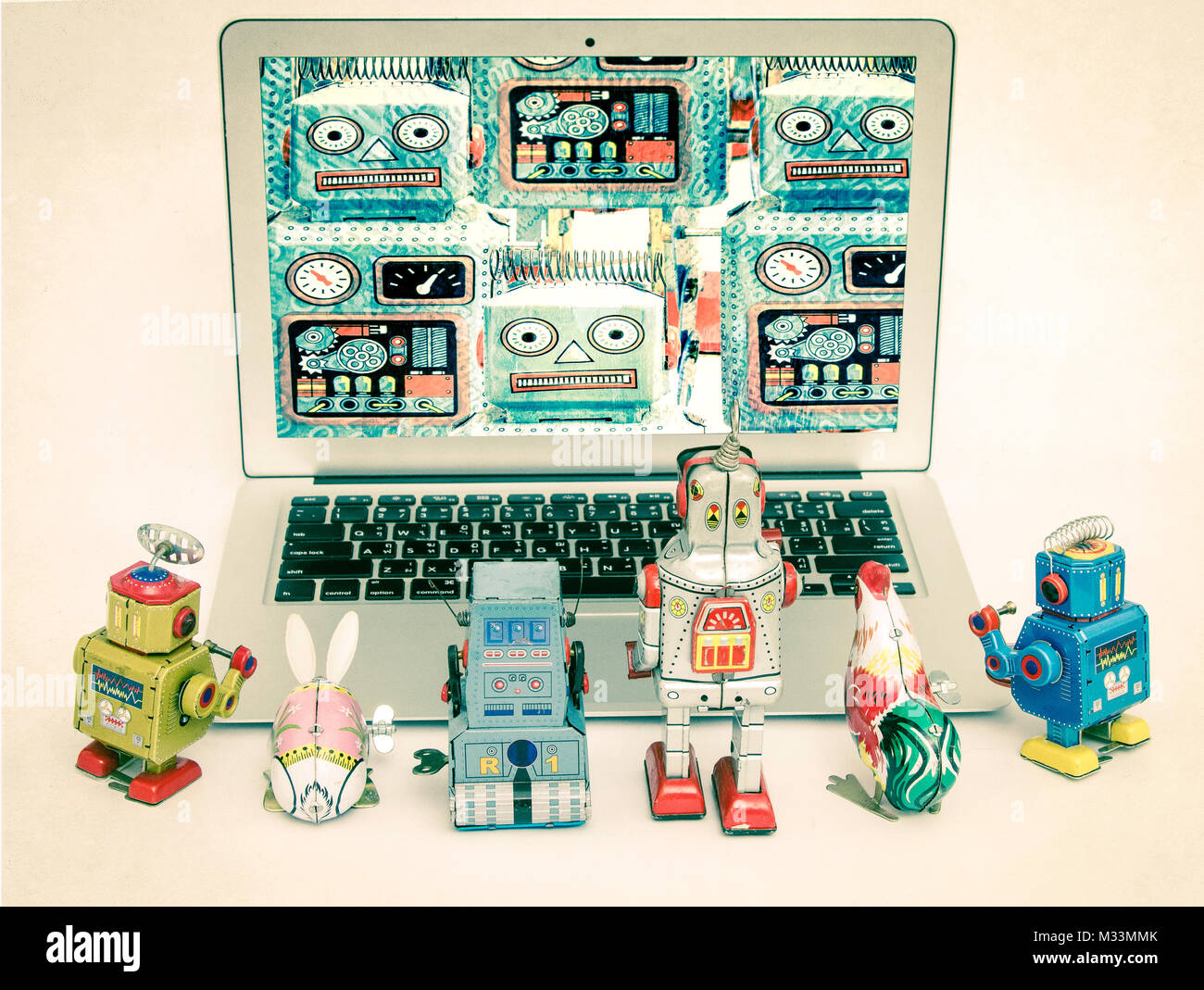Machine learning concept with retro toy robots Stock Photo - Alamy