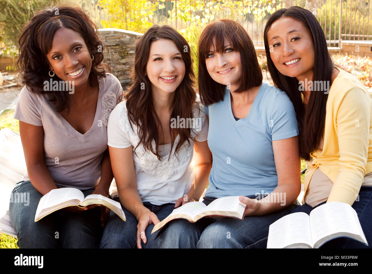 Beautiful diverse group of women talking and laughing Stock Photo - Alamy