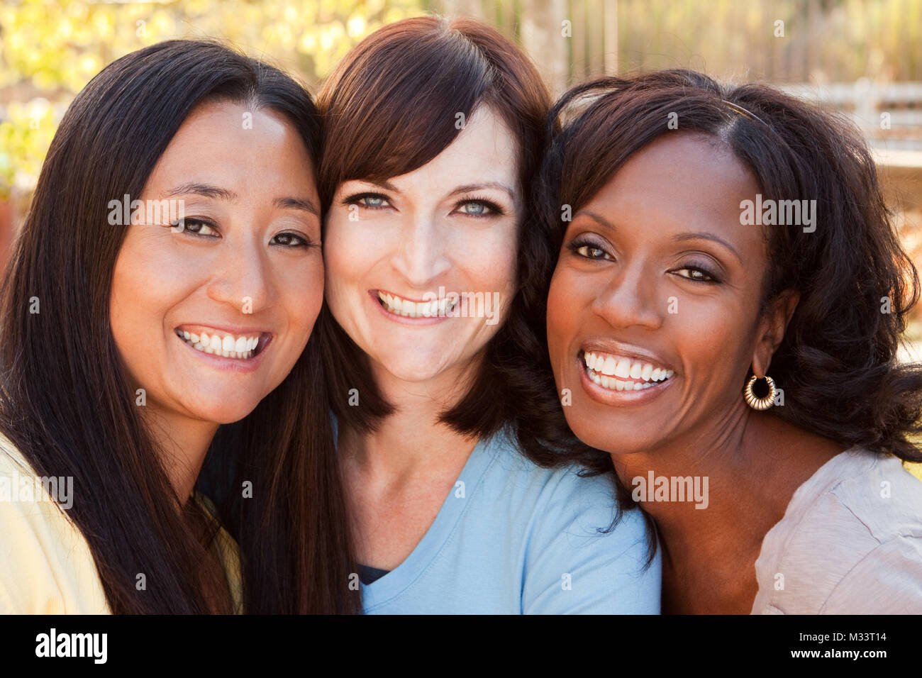 Beautiful diverse group of women talking and laughing Stock Photo - Alamy