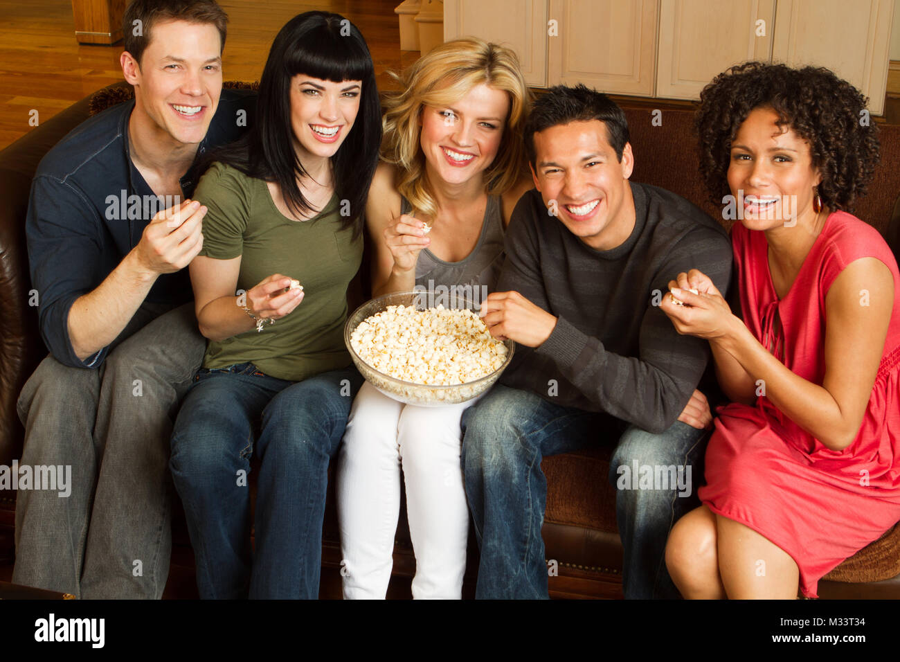 Diverse group of friends talking and laughing Stock Photo - Alamy