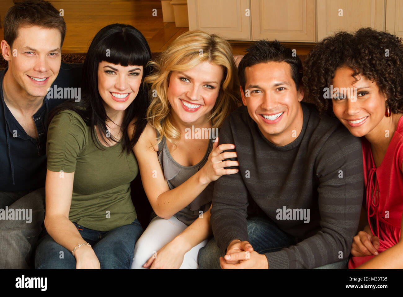 Diverse group of friends talking and laughing Stock Photo - Alamy