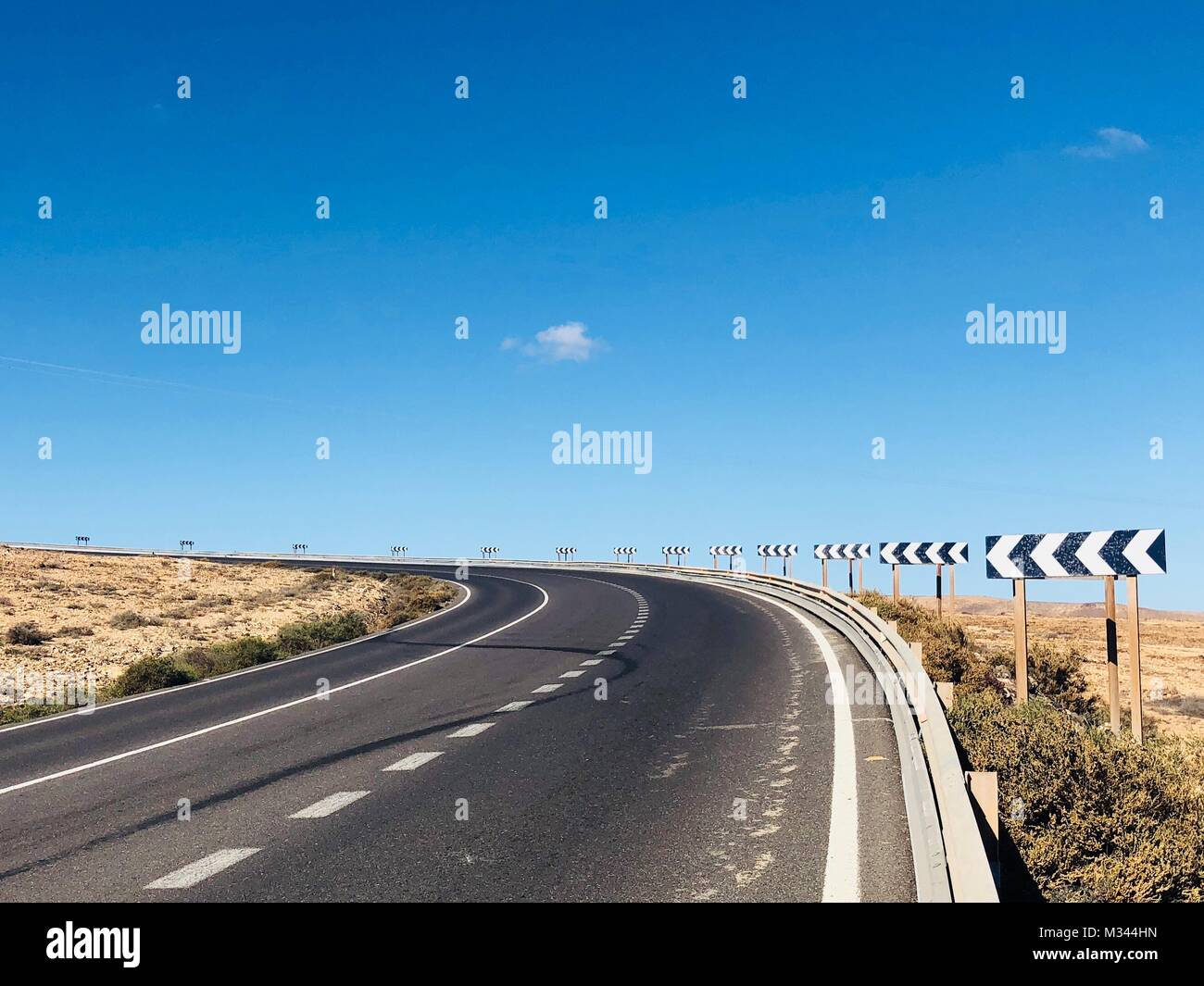 Chevron signs on a road, Fuerteventura, Las Palmas, Canary Islands ...
