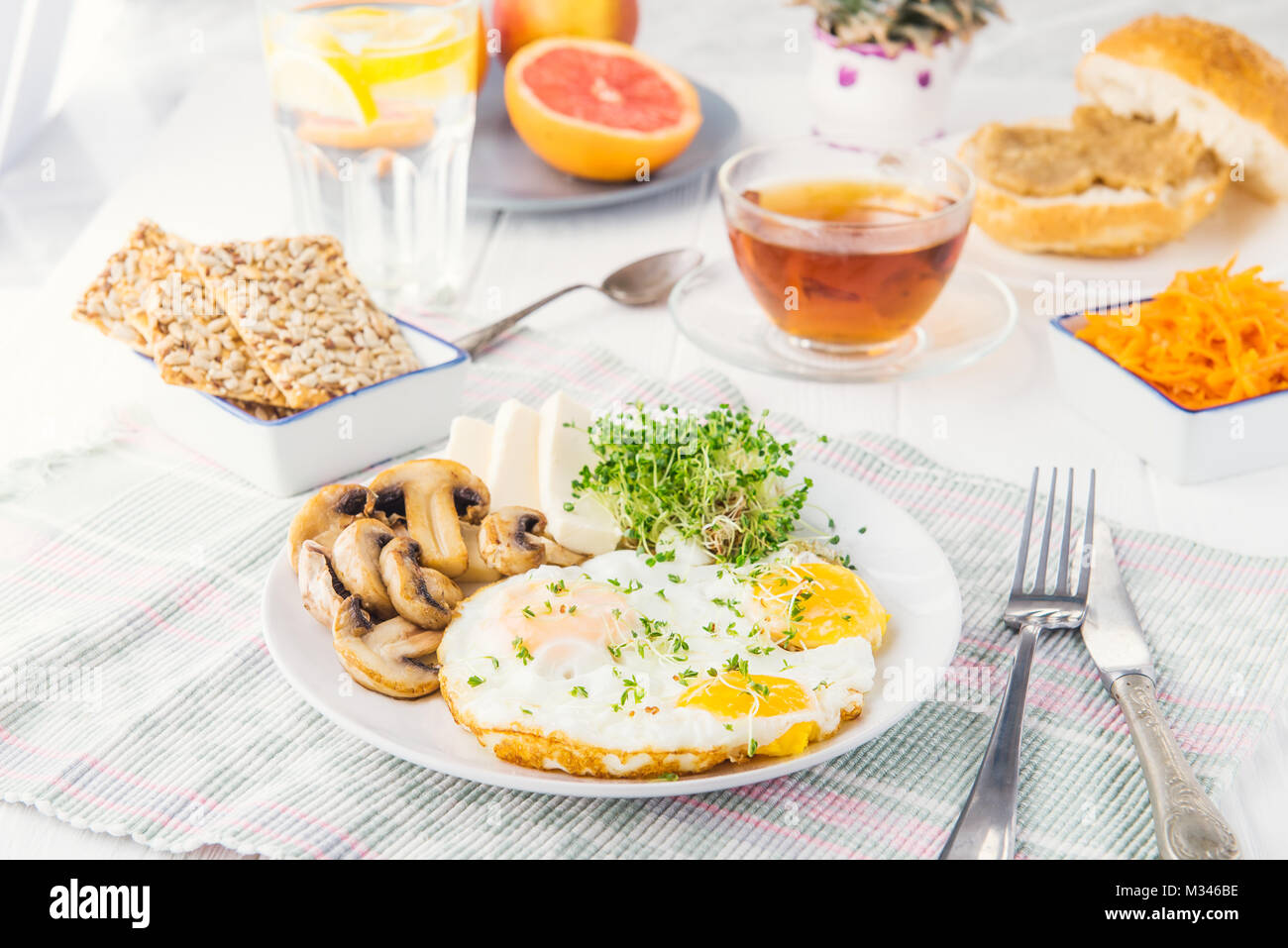 Healthy breakfast plate with scrambled eggs, cheese, grilled mushrooms ...