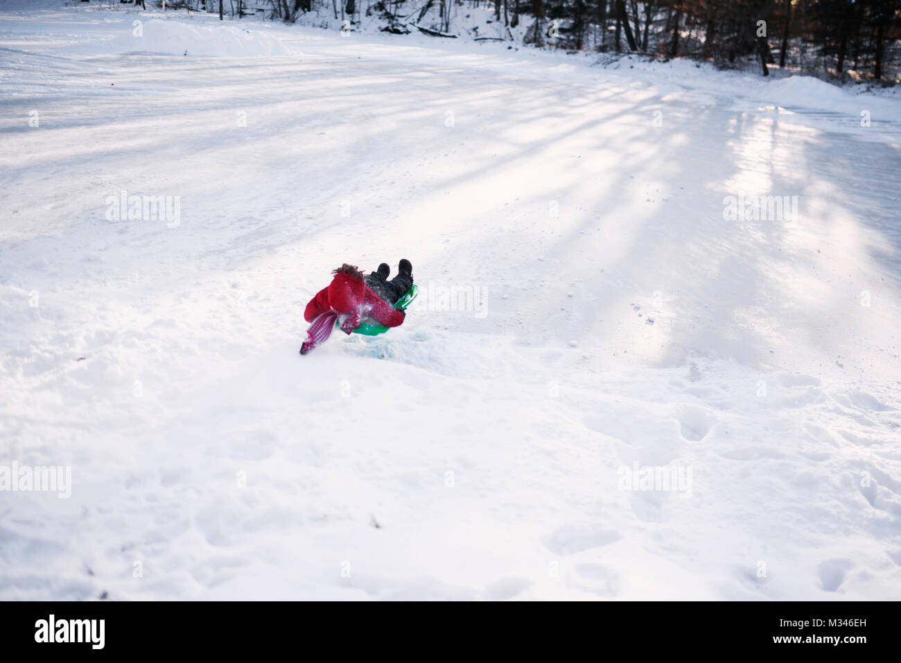 Person sledging in snow hi-res stock photography and images - Alamy
