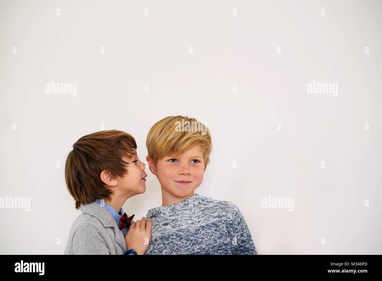 Children whispering hi-res stock photography and images - Alamy