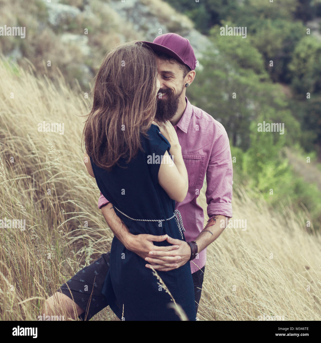 Heterosexual couple embracing standing hi-res stock photography and ...