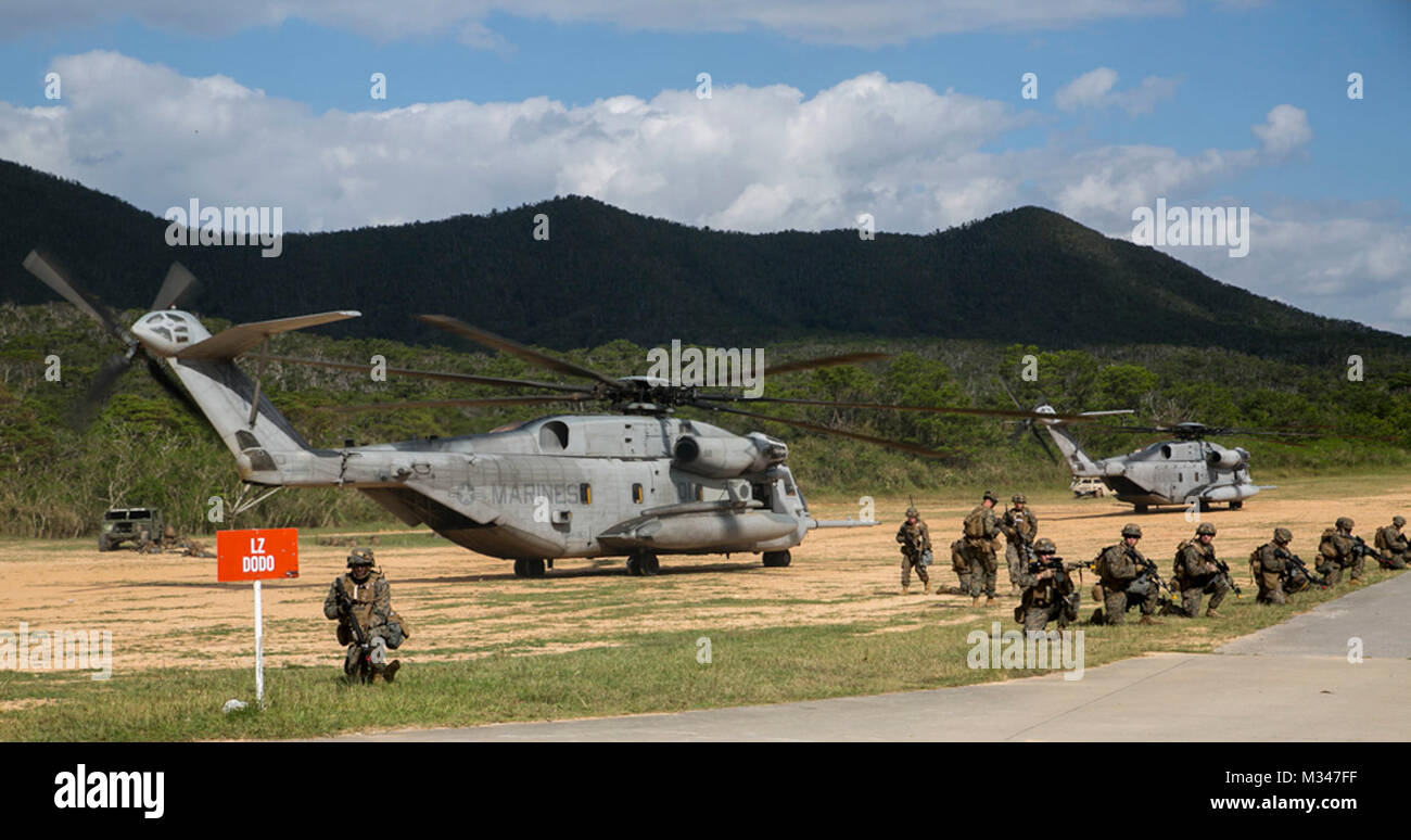 Marines set up security after offloading a CH-53E Super Stallion Nov. 4 ...