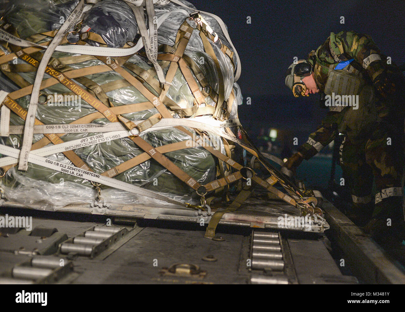 Cargo is unloaded off a C-130 during operational readiness exercise ...