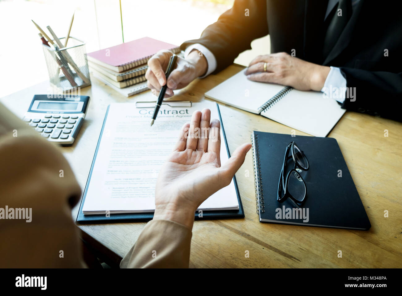 Young business team working with new startup project offering contract ...