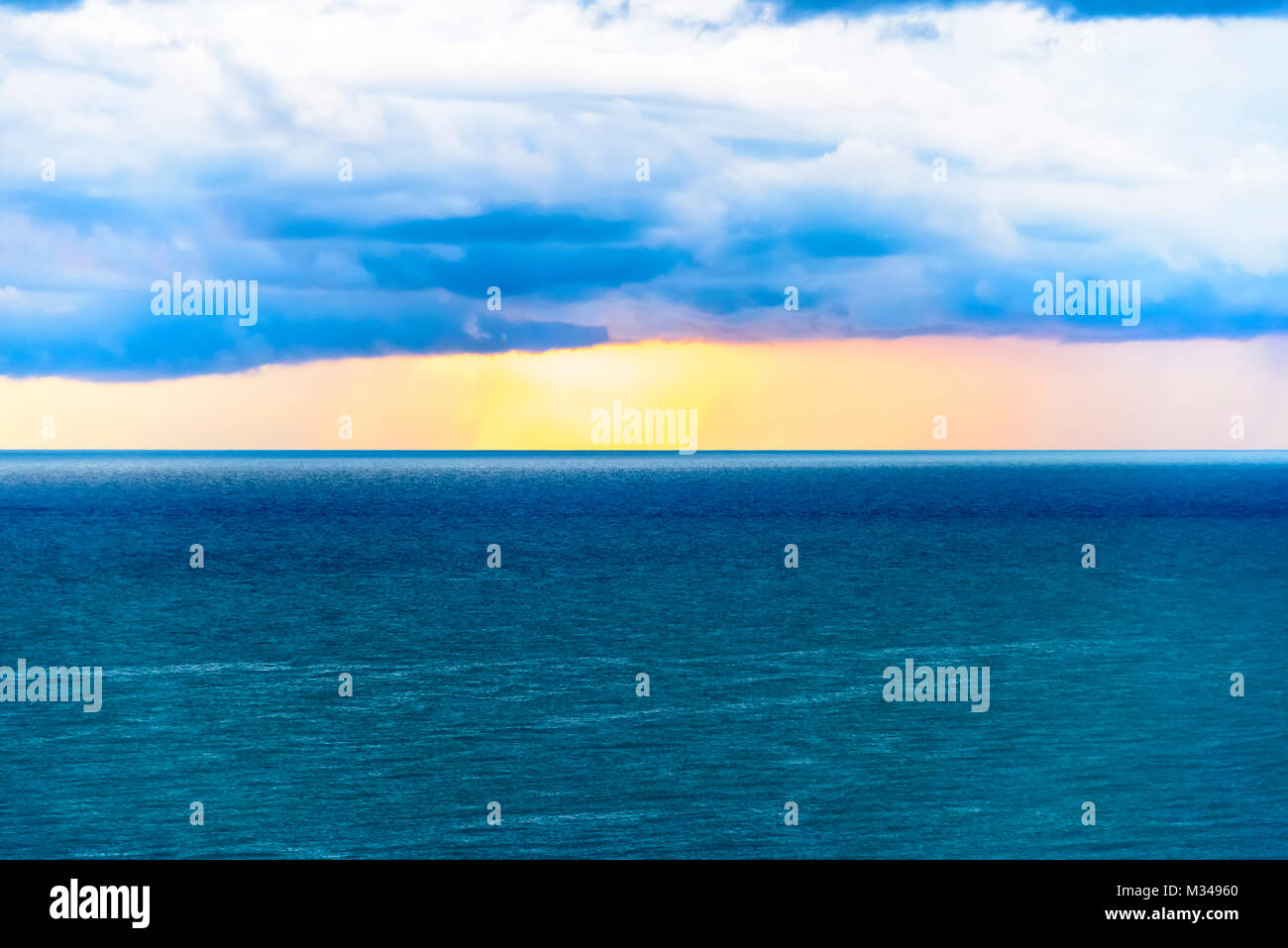 A calming, relaxing seascape oceanscape sunset showing a blue sea, blue ...
