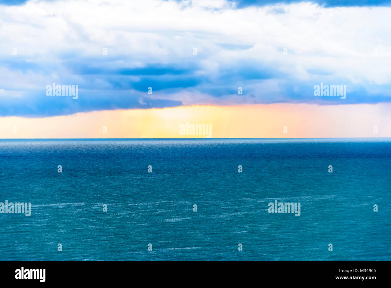 A calming, relaxing seascape oceanscape sunset showing a blue sea, blue ...