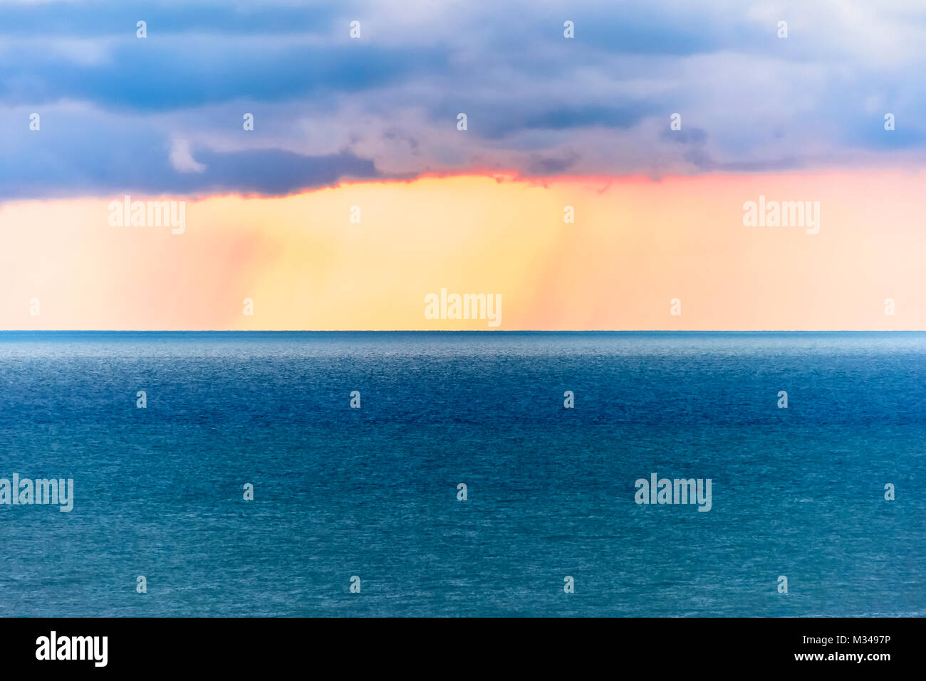 A calming, relaxing seascape oceanscape sunset showing a blue sea, blue ...