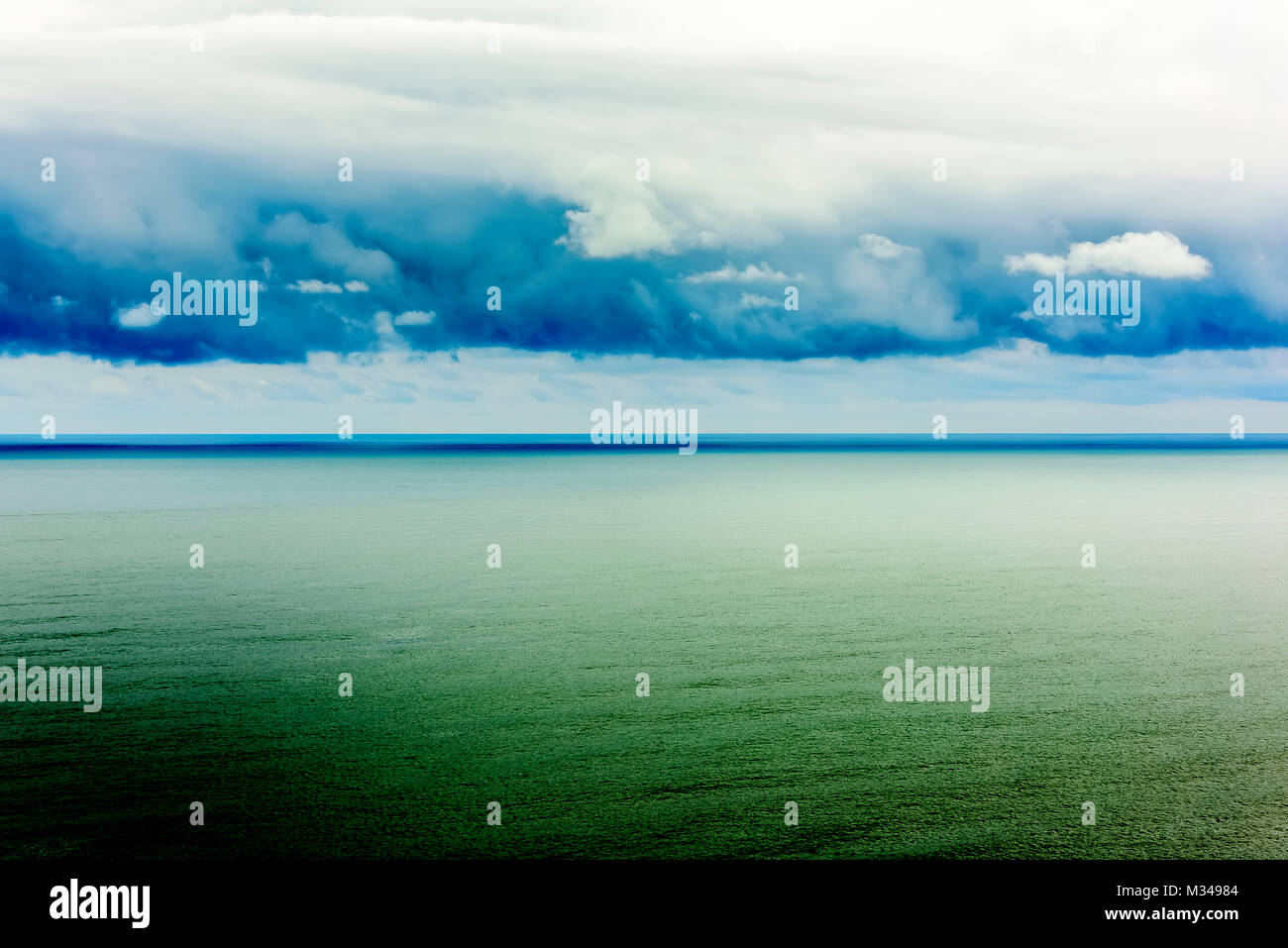 A calming, relaxing seascape oceanscape sunset showing a blue sea, blue ...