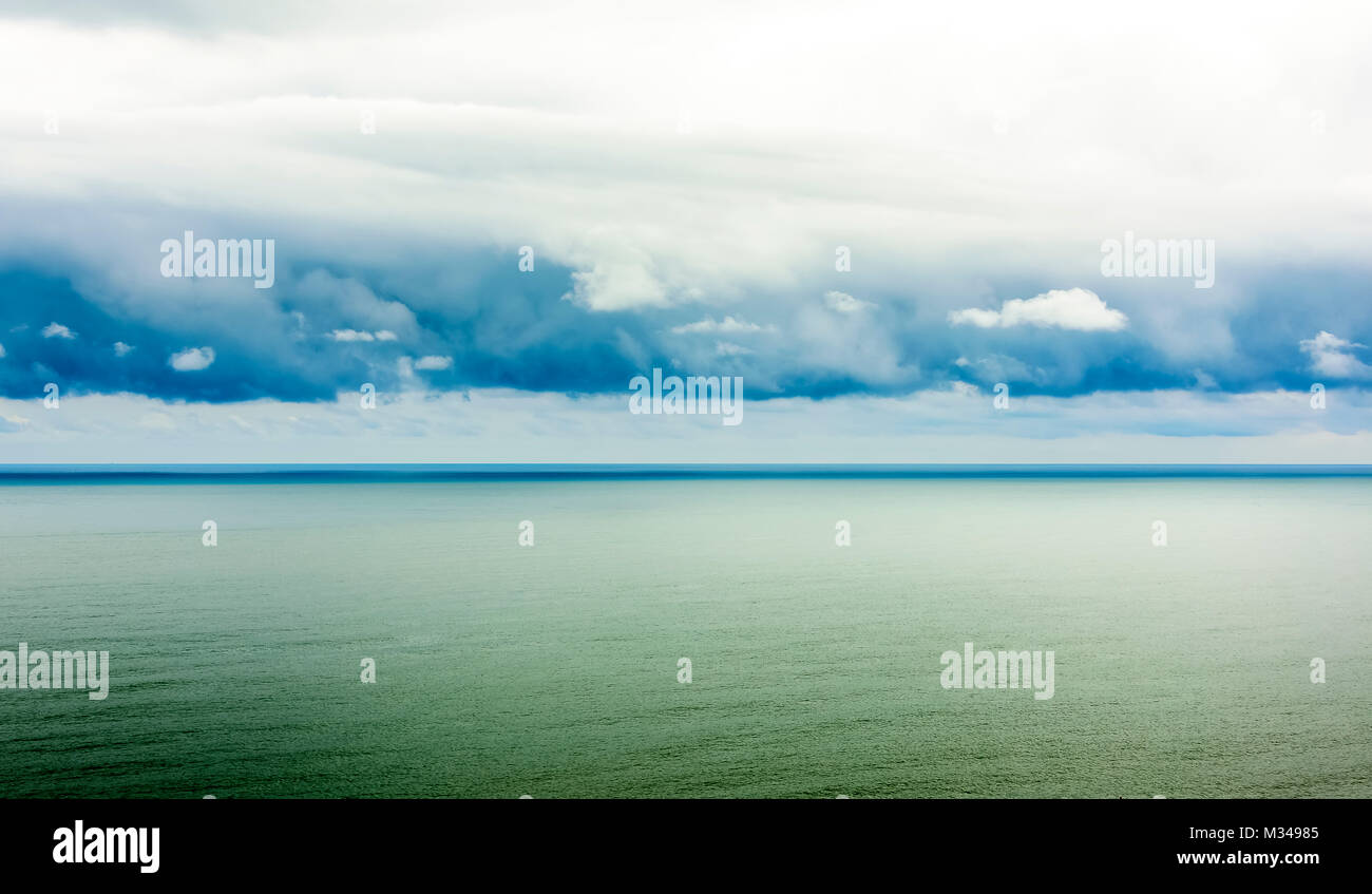 A calming, relaxing seascape oceanscape sunset showing a blue sea, blue ...