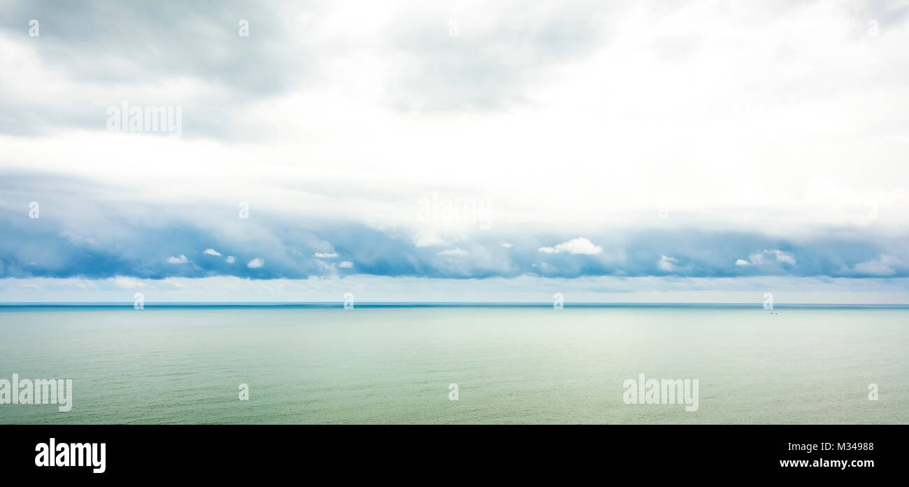 A calming, relaxing seascape oceanscape sunset showing a blue sea, blue ...