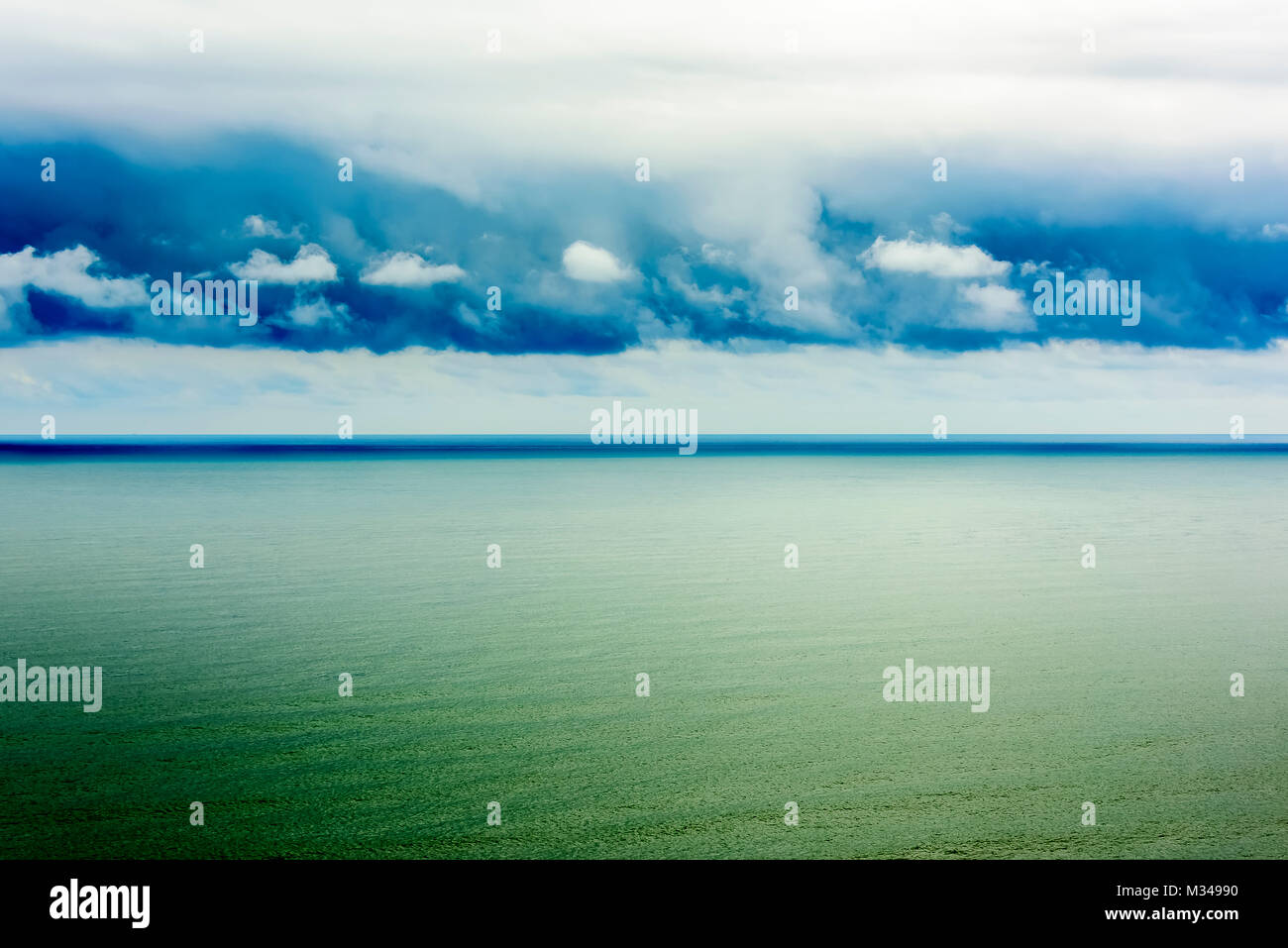 A calming, relaxing seascape oceanscape sunset showing a blue sea, blue ...