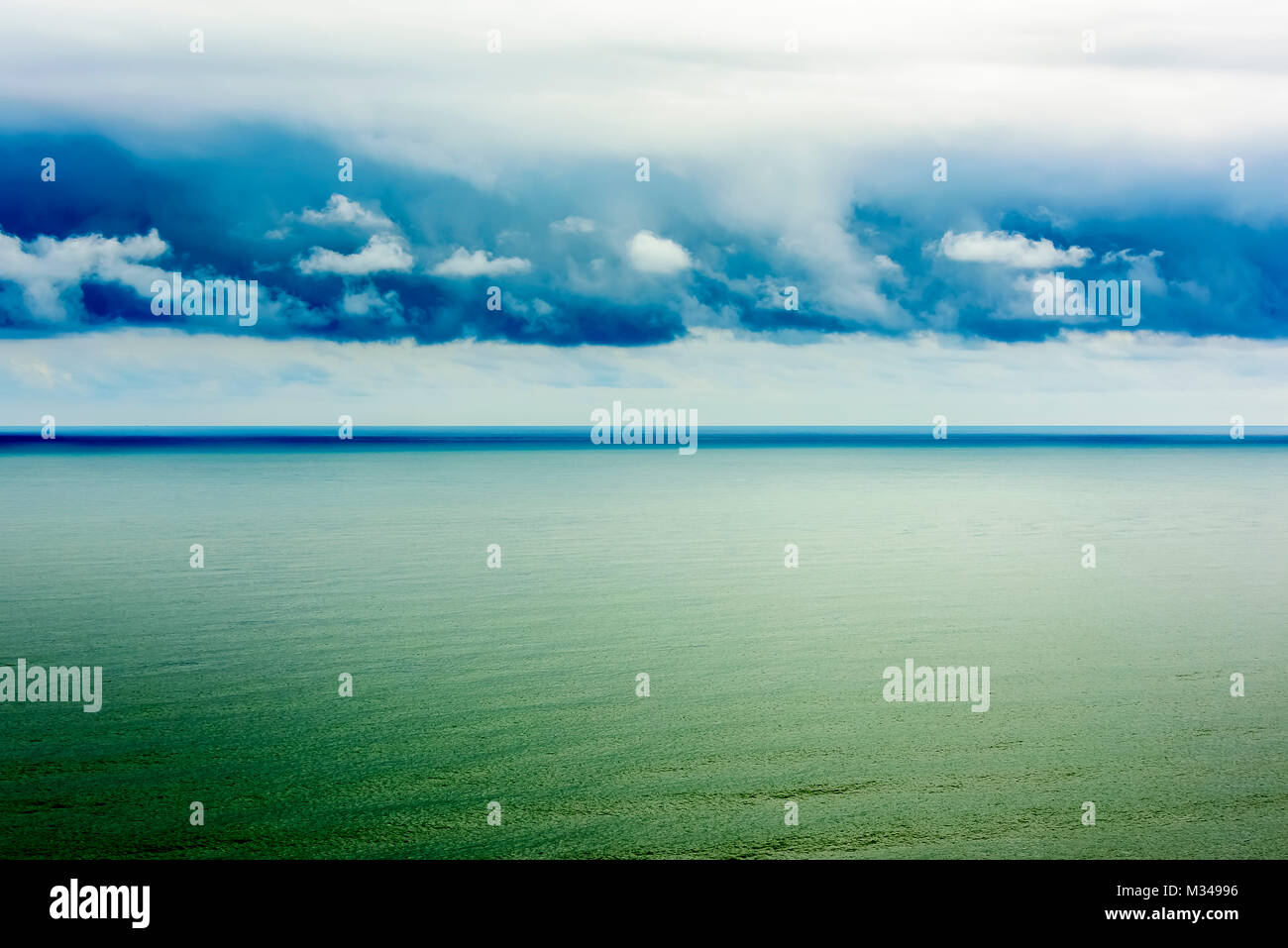 A calming, relaxing seascape oceanscape sunset showing a blue sea, blue ...