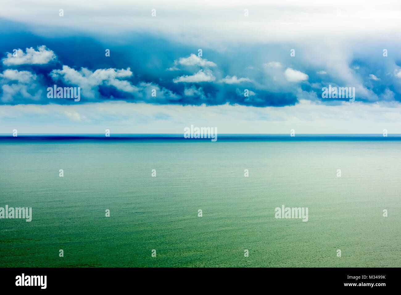 A calming, relaxing seascape oceanscape sunset showing a blue sea, blue ...