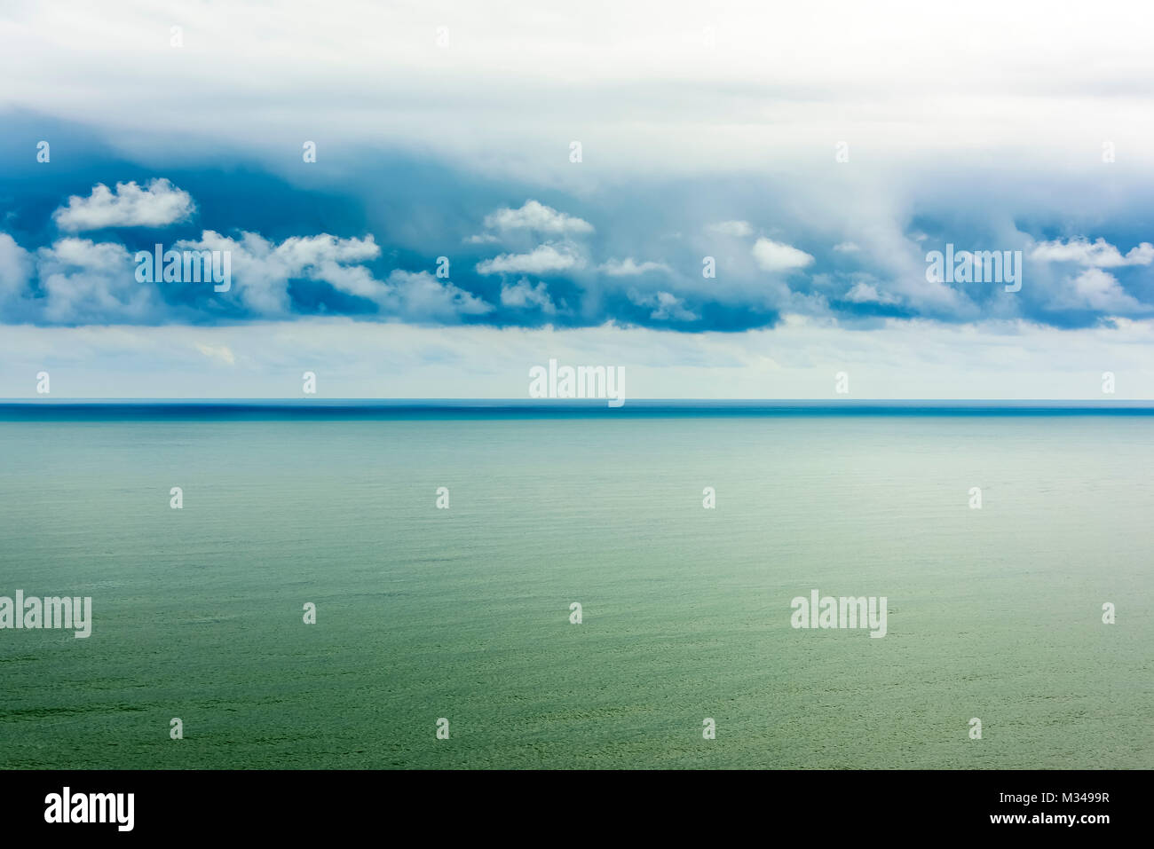 A calming, relaxing seascape oceanscape sunset showing a blue sea, blue ...