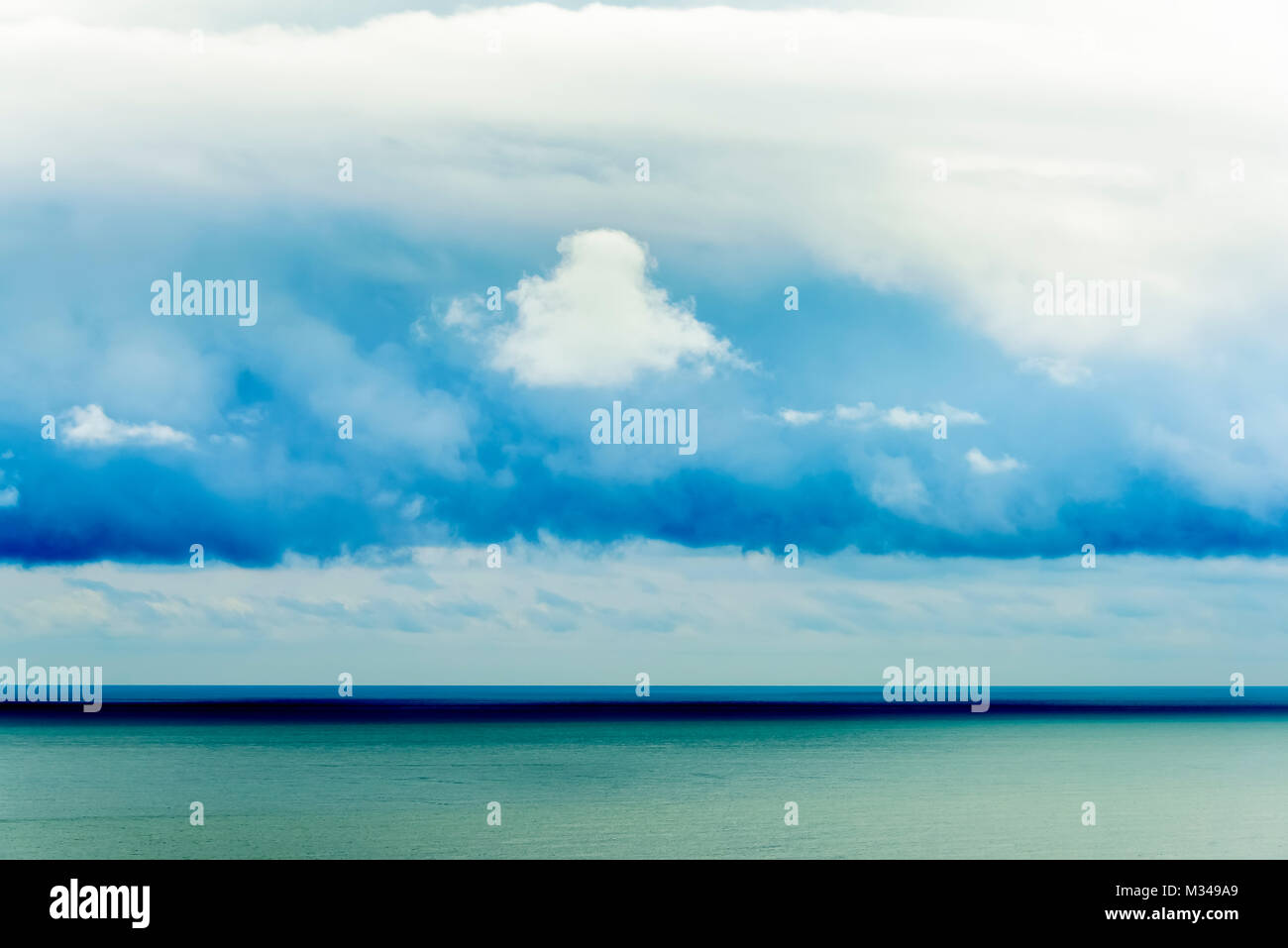 A calming, relaxing seascape oceanscape sunset showing a blue sea, blue ...