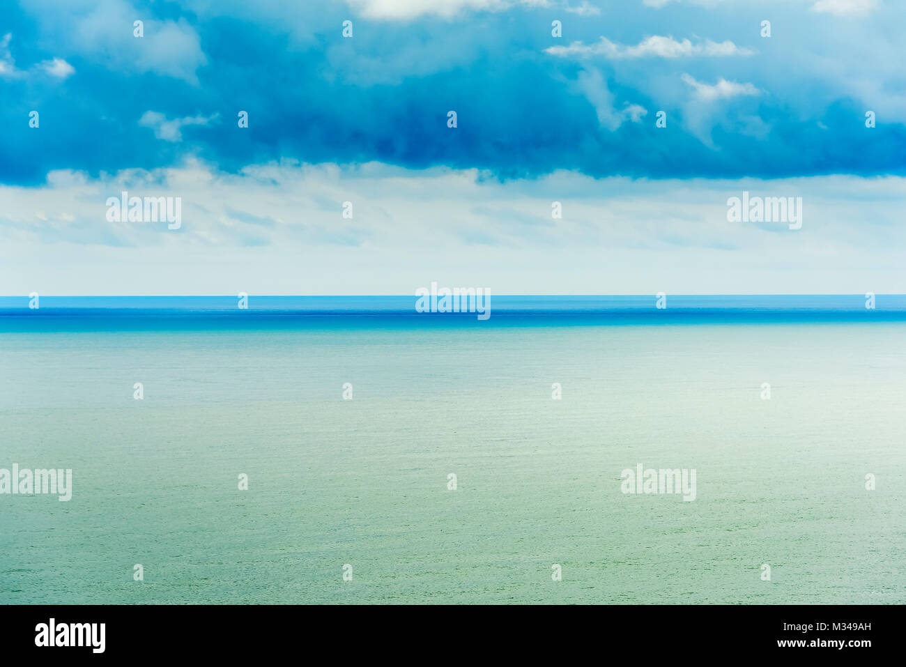 A calming, relaxing seascape oceanscape sunset showing a blue sea, blue ...